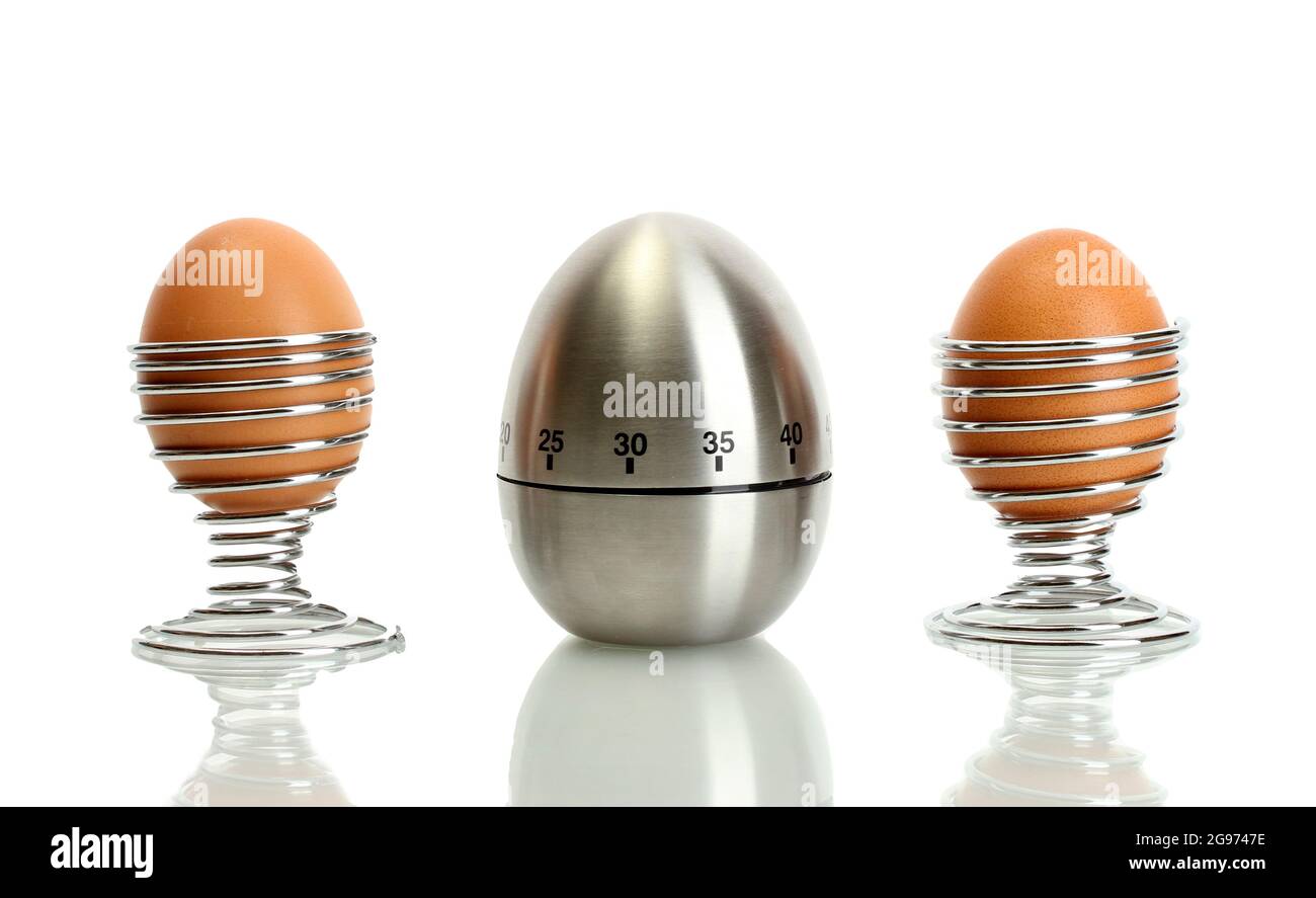 egg timer and egg in metal stand isolated on white Stock Photo - Alamy