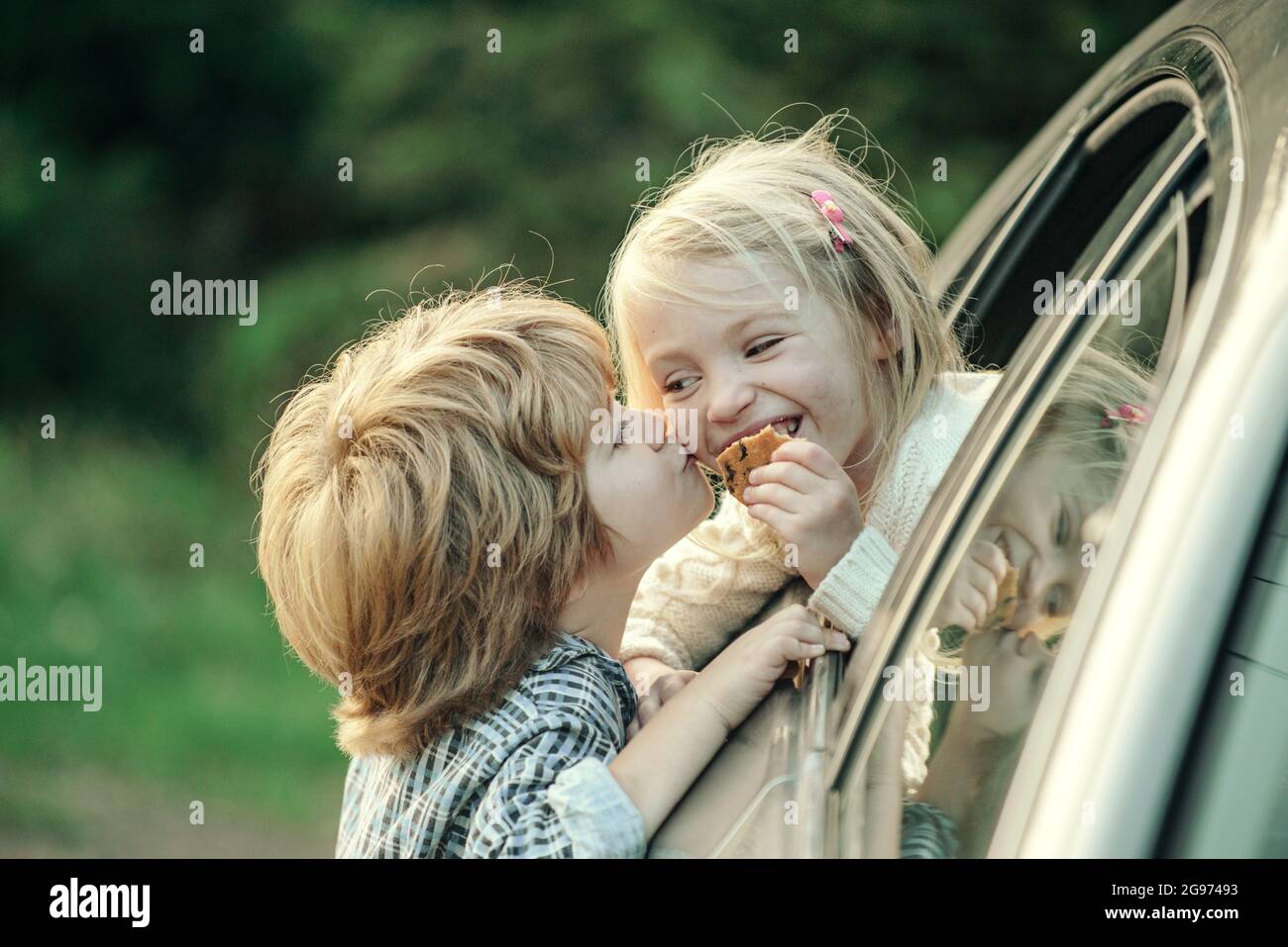 Funny little couple saying goodbye before car travel. Bye bye. Farewell ...