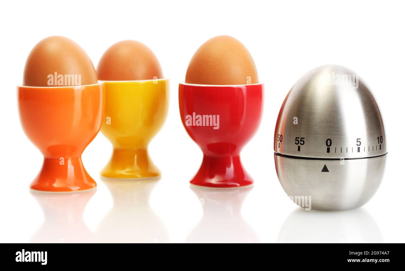 egg timer and egg in color stand isolated on white Stock Photo - Alamy