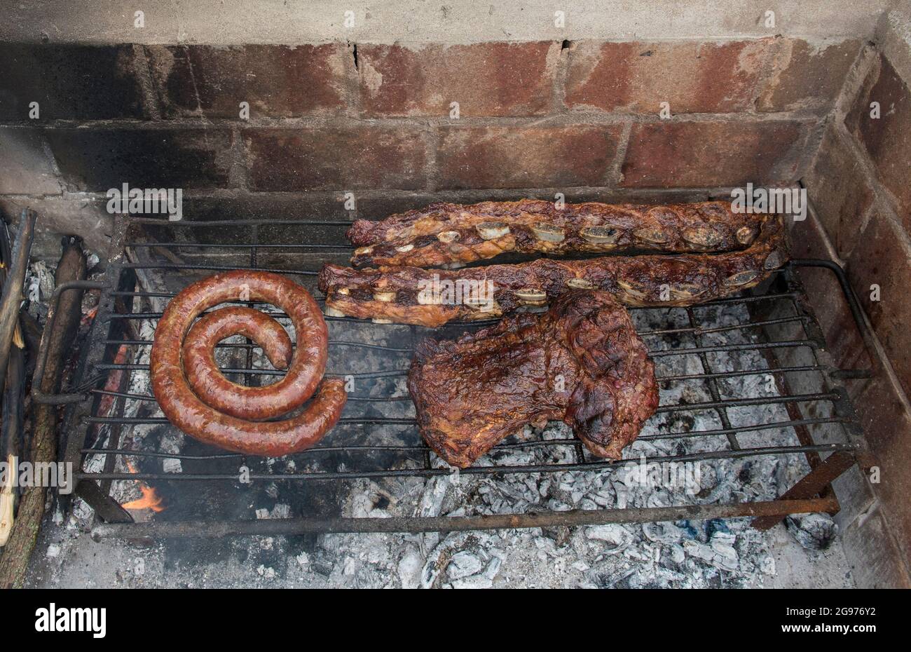 Grilled beef and pork sausages, traditional Argentine Asado, La Pampa ...