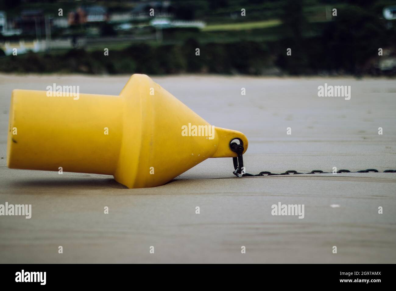 Yellow buoy on a chain on the beach hi-res stock photography and images ...