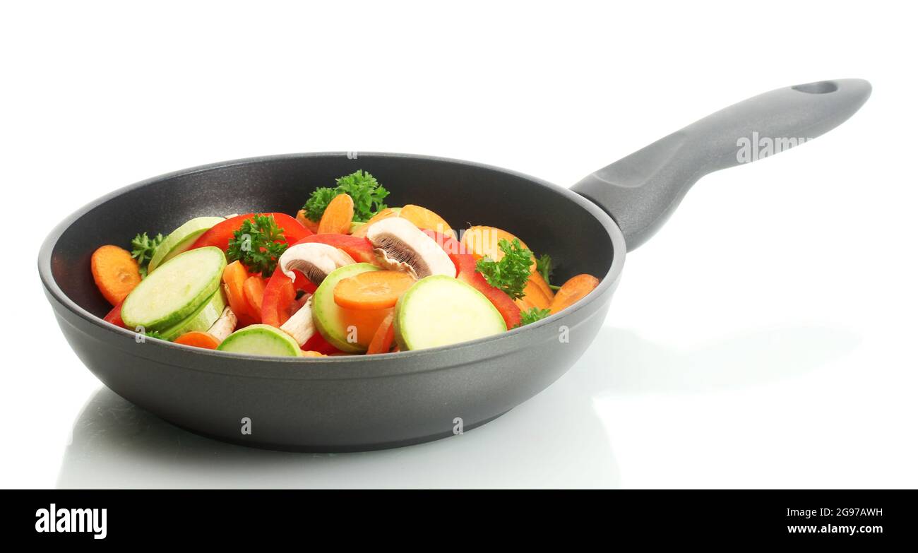 frying pan with vegetables on white Stock Photo - Alamy