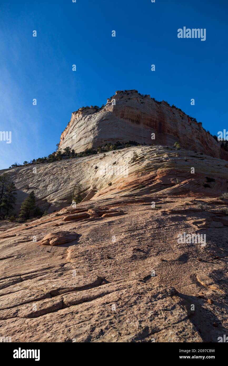 Smooth sandstone rock of a mountainside that has eroded over the years ...
