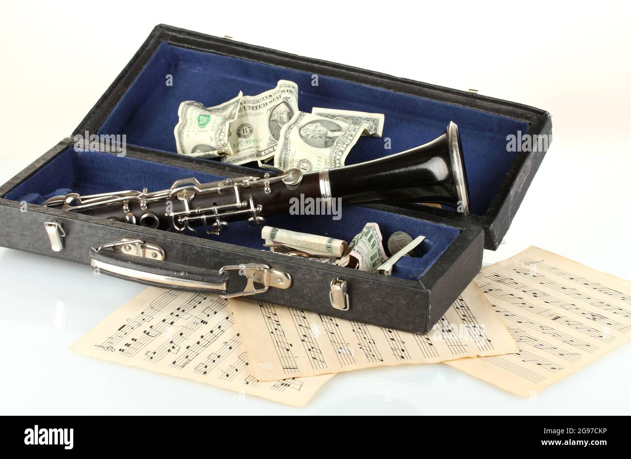 musical instrument with money isolated on white Stock Photo - Alamy