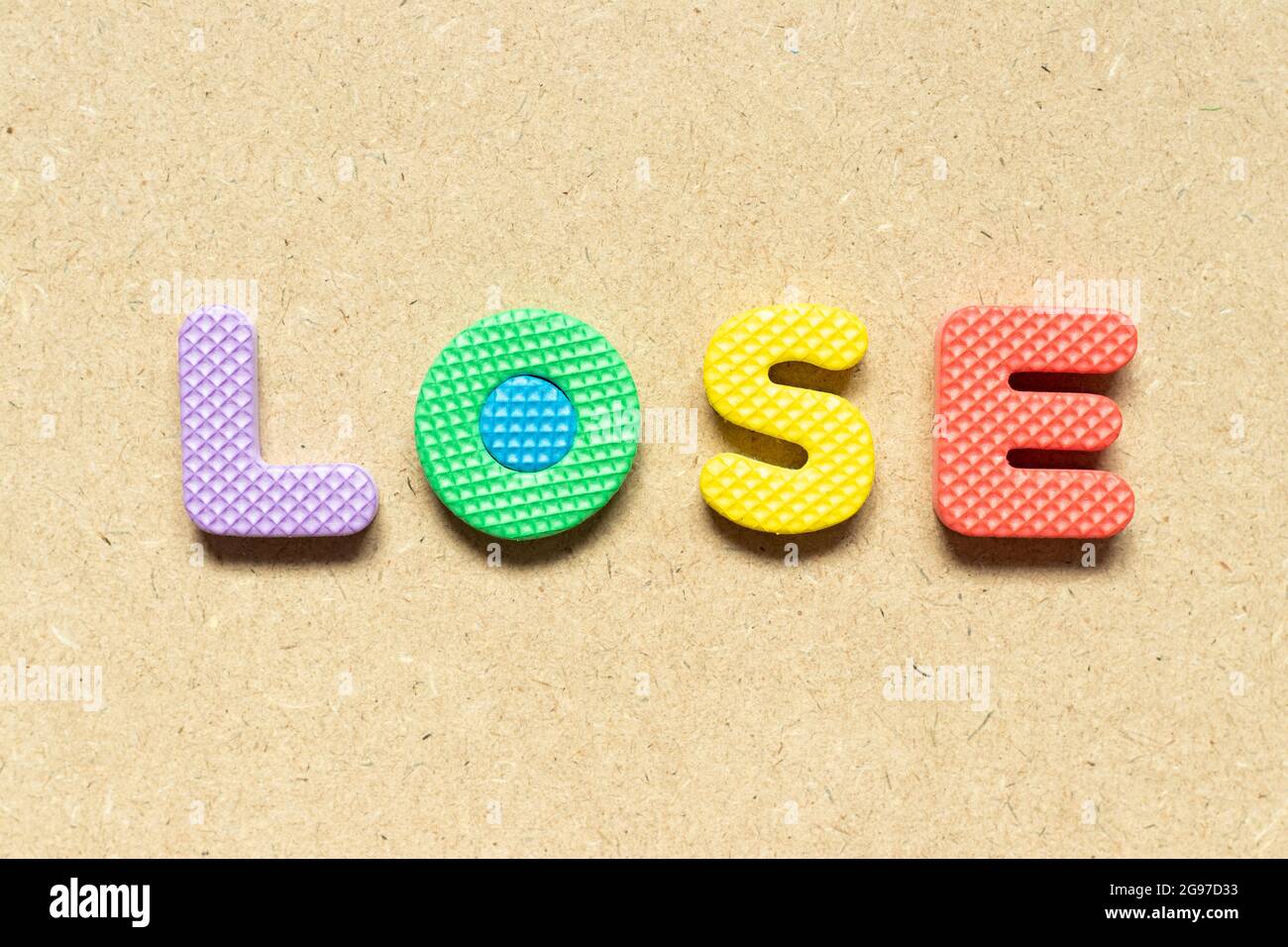 Foam alphabet letter in word lose on wood background Stock Photo - Alamy