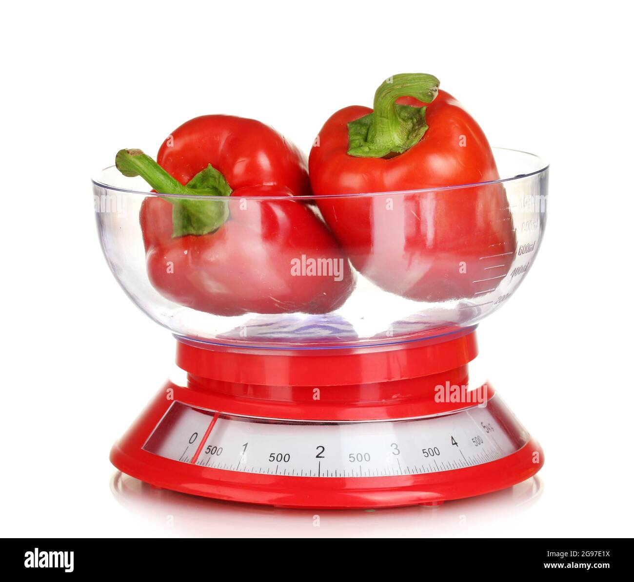 fresh red peppers in a kitchen scales isolated on white Stock Photo - Alamy