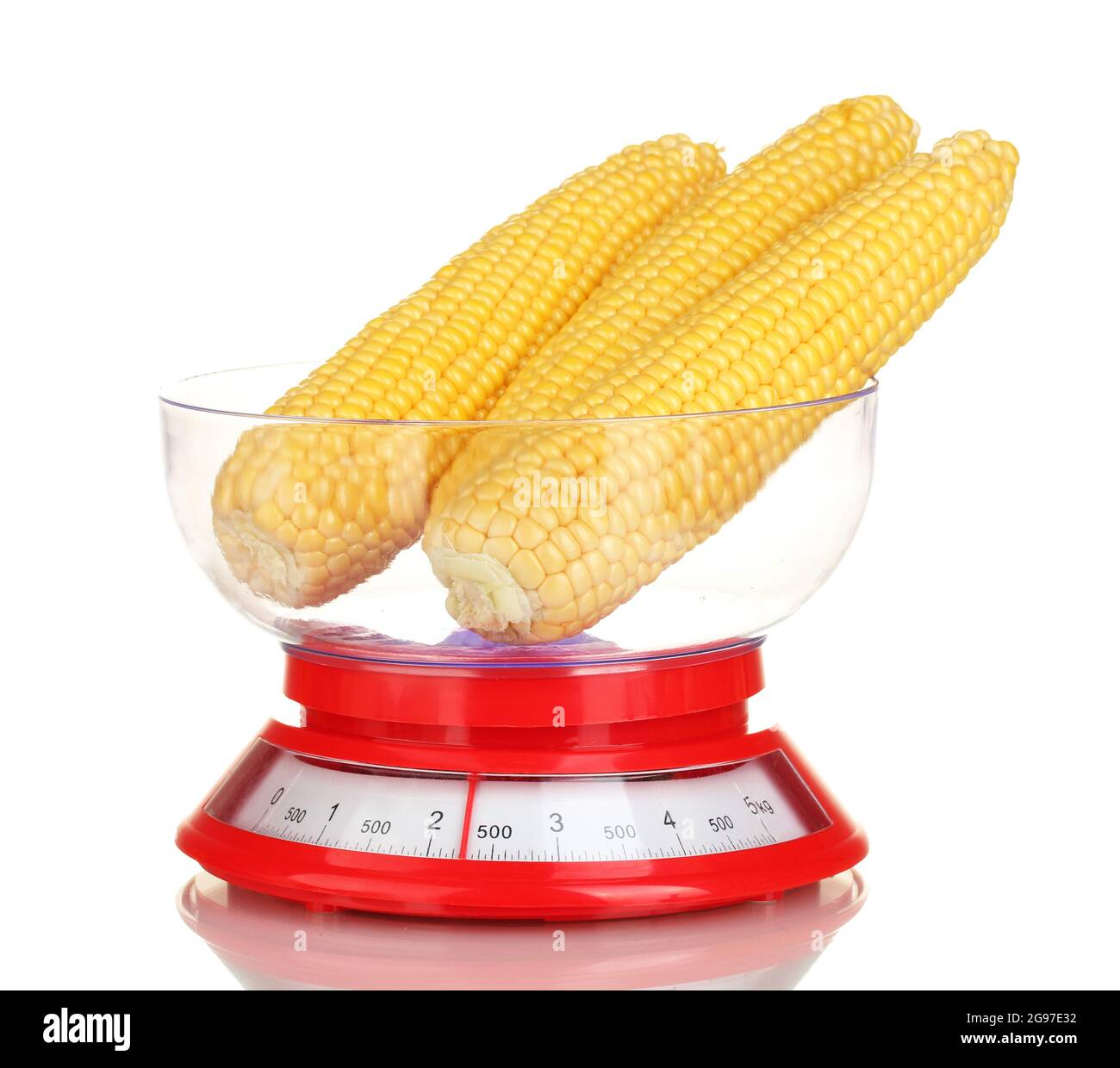 fresh corn in a kitchen scales isolated on white Stock Photo - Alamy