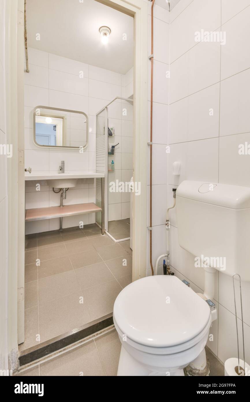 Interior of small clean washroom in miniature style Stock Photo - Alamy