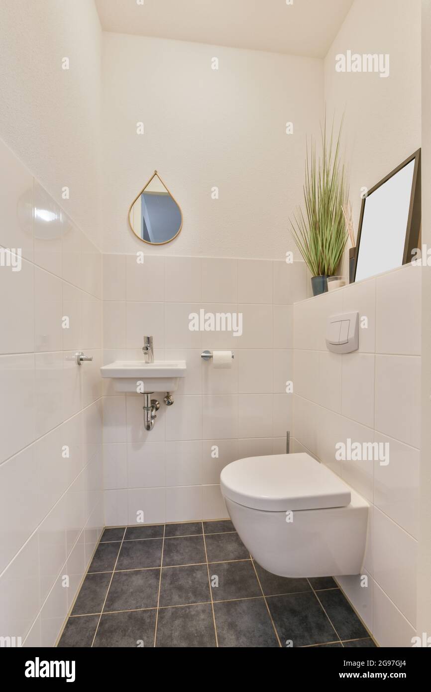 Interior of small clean washroom in miniature style Stock Photo - Alamy