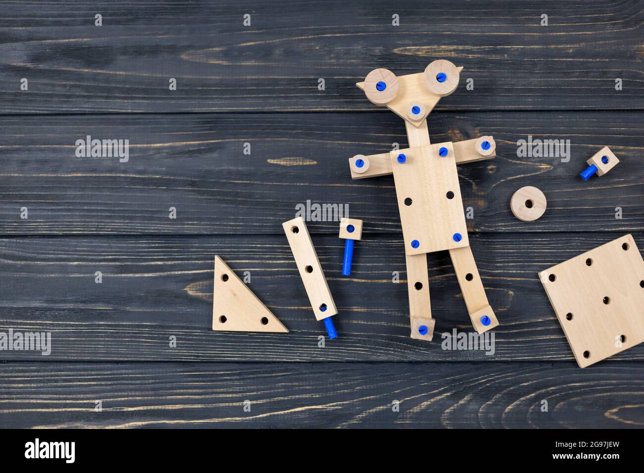 A colorful wooden building kit, robot for children on wood. Set of ...