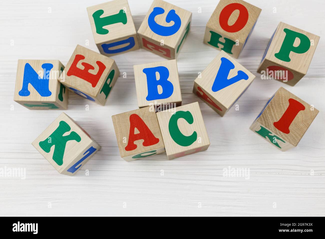 Wooden blocks spell out ABC on wooden table. Games and tools for kids ...