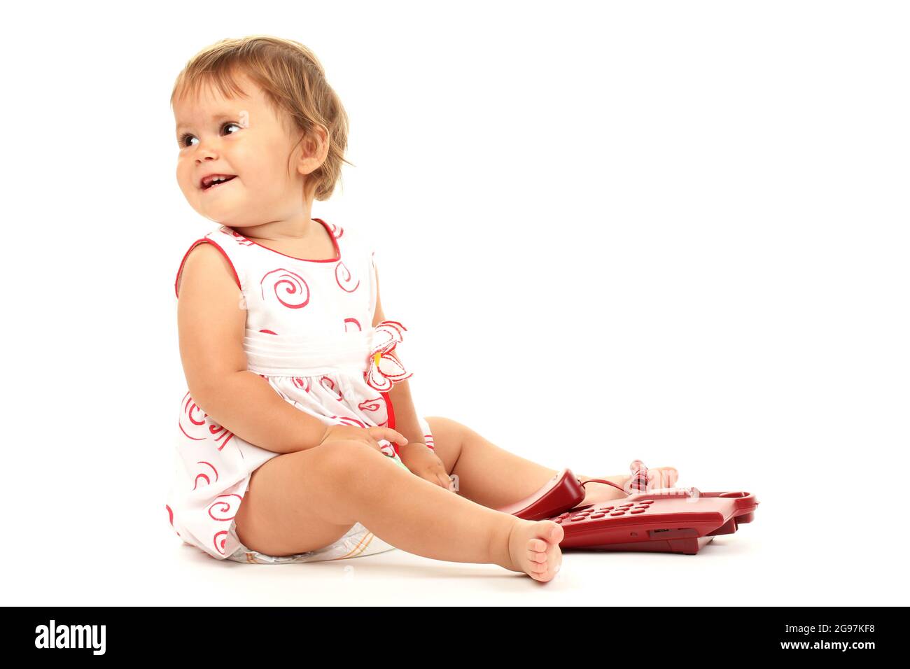 Cute baby with telephone isolated on white Stock Photo - Alamy