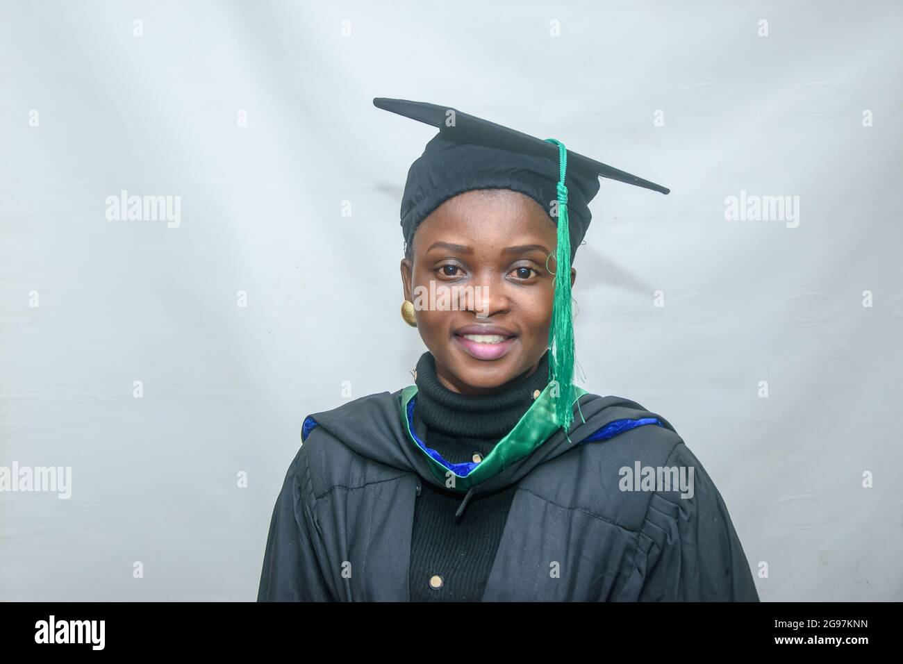 Portrait of a happy African female graduand or graduating students ...