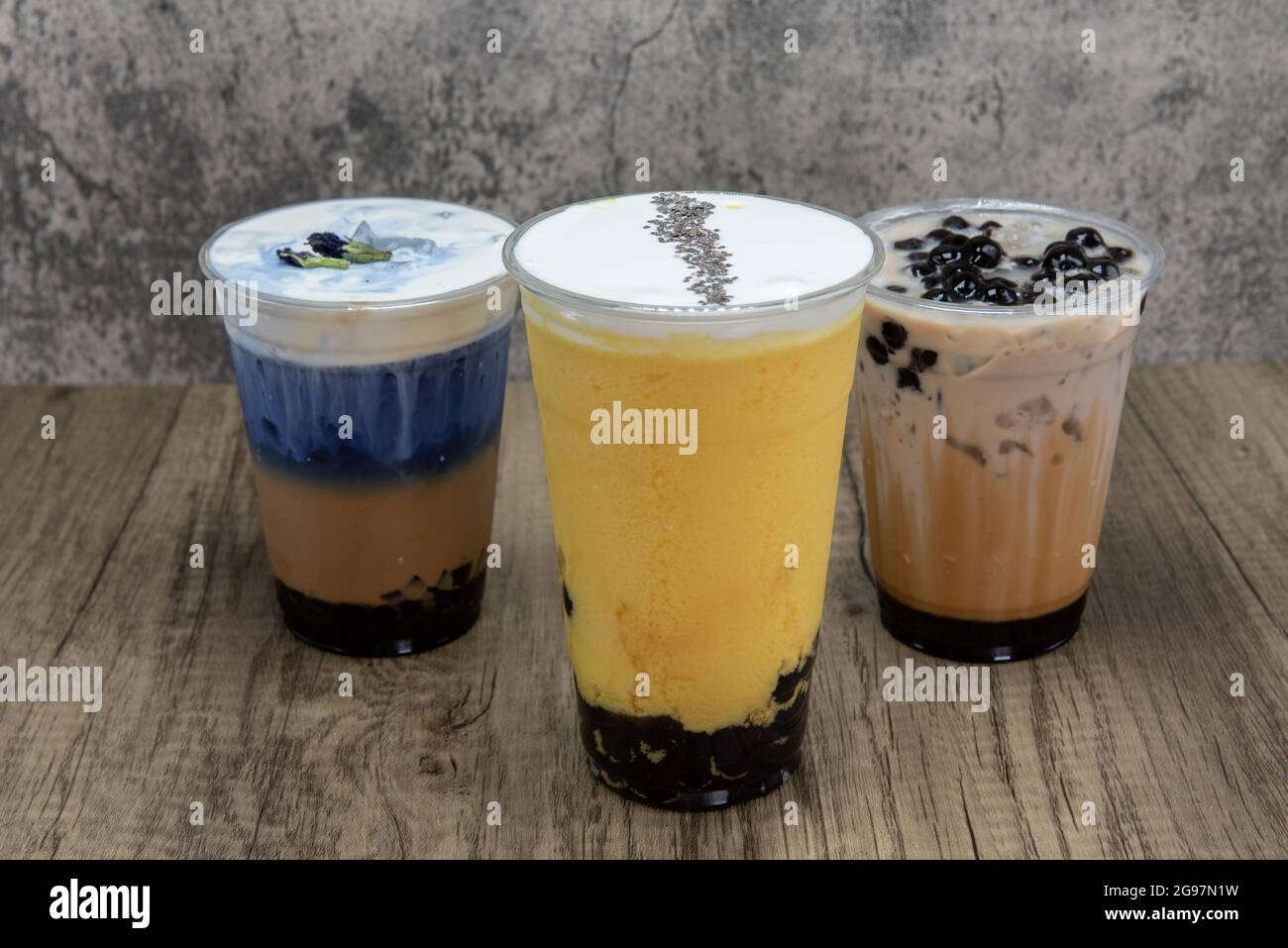 Variety of cold beverage mixes iced boba mango, blue, and brown sugar ...