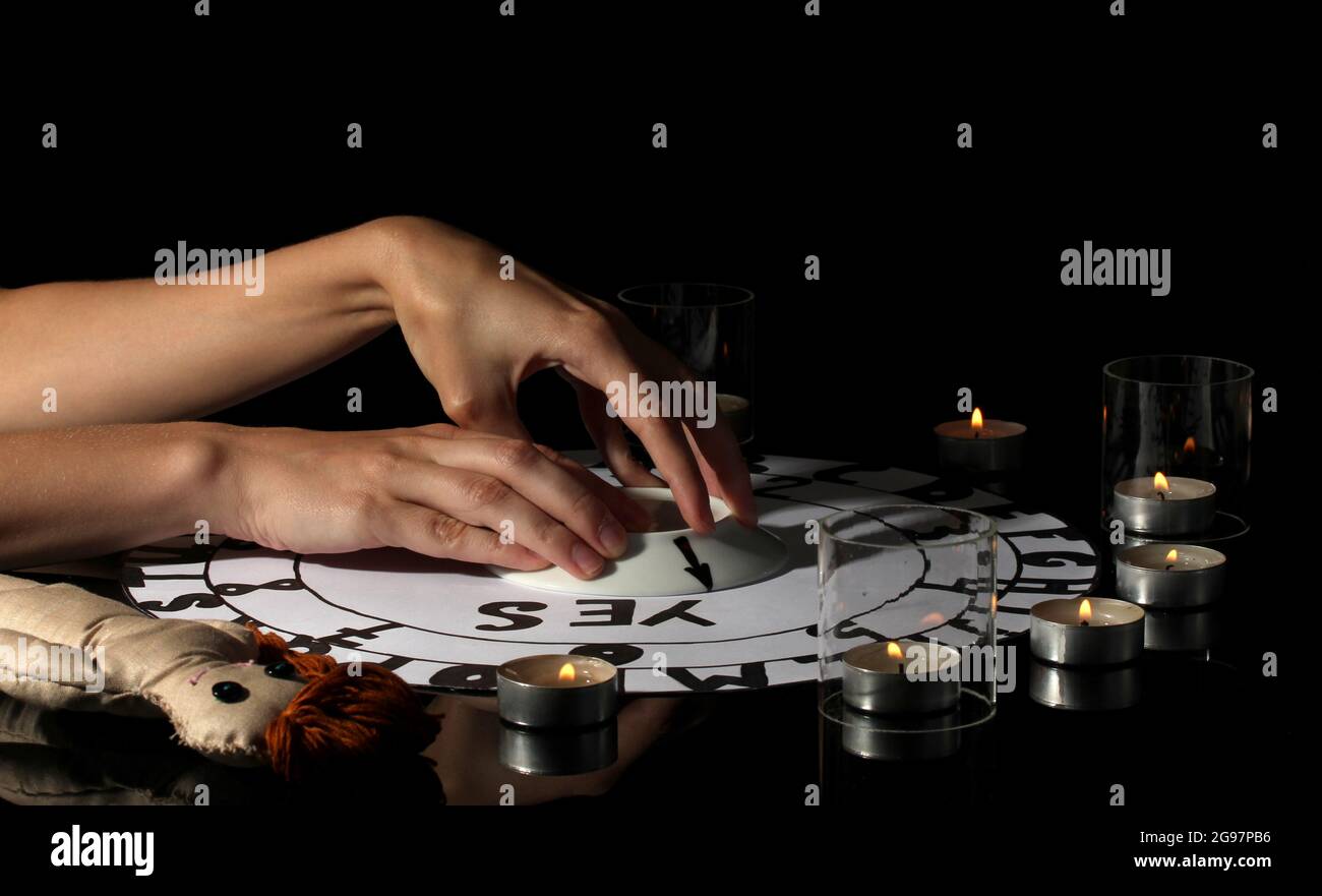 spiritualistic seance by candlelight close-up Stock Photo - Alamy