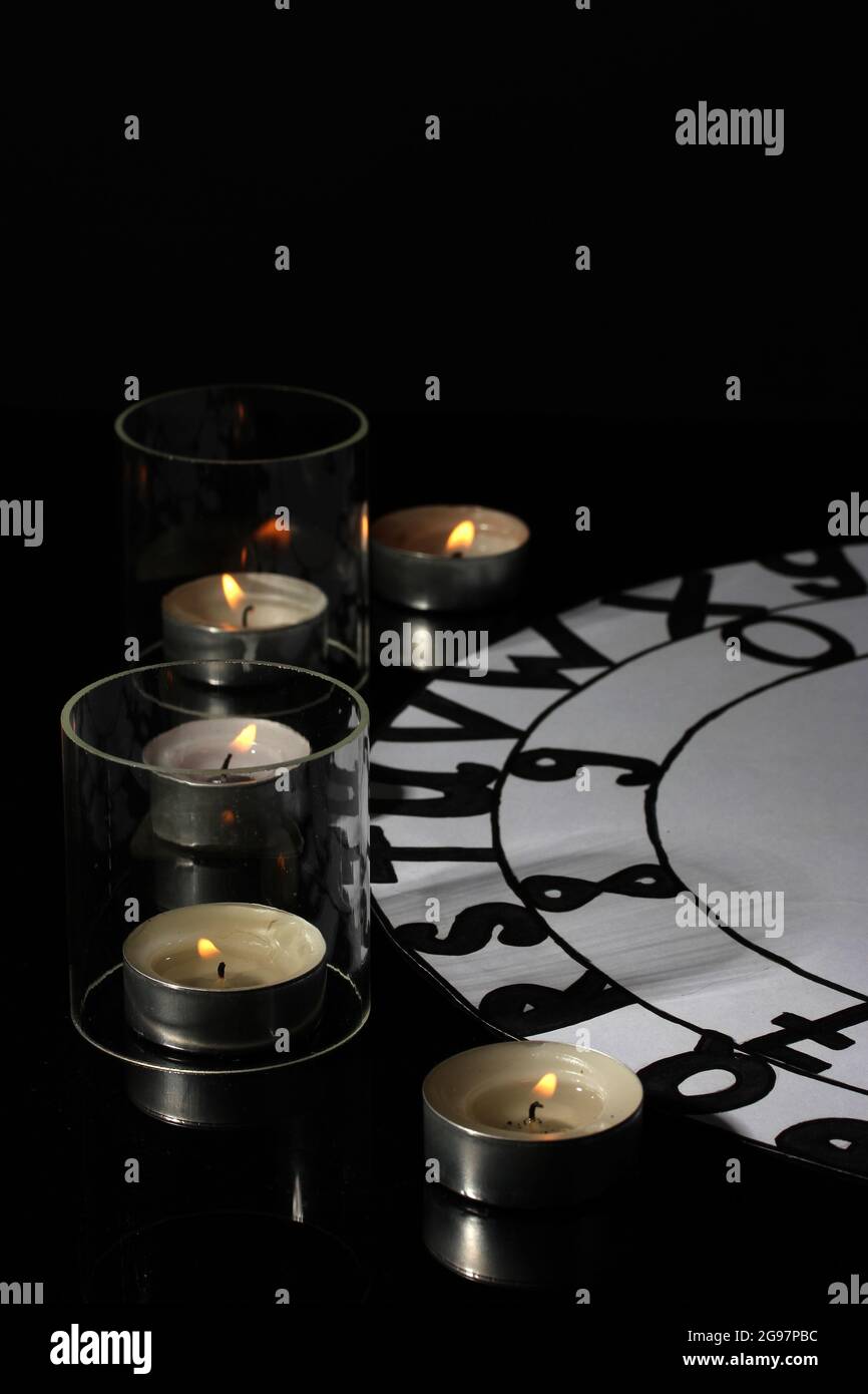 spiritualistic seance by candlelight close-up Stock Photo - Alamy