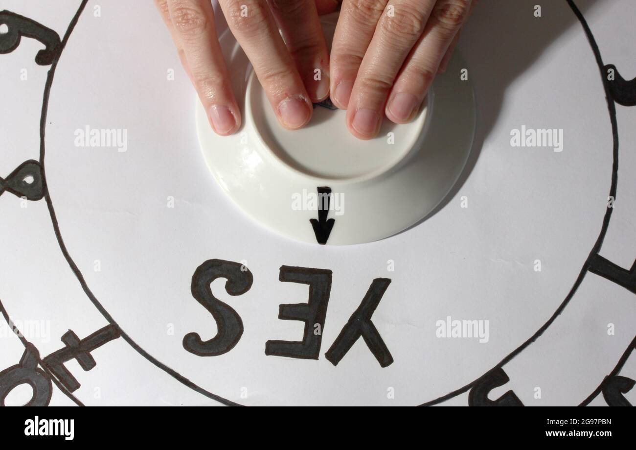 spiritualistic seance by candlelight close-up Stock Photo - Alamy