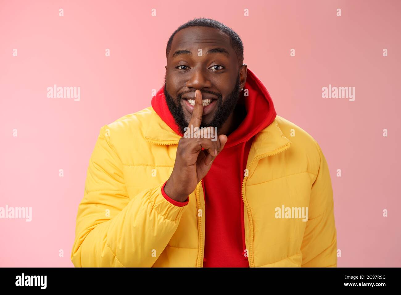Charming happy young african-american bearded guy in yellow jacket red ...