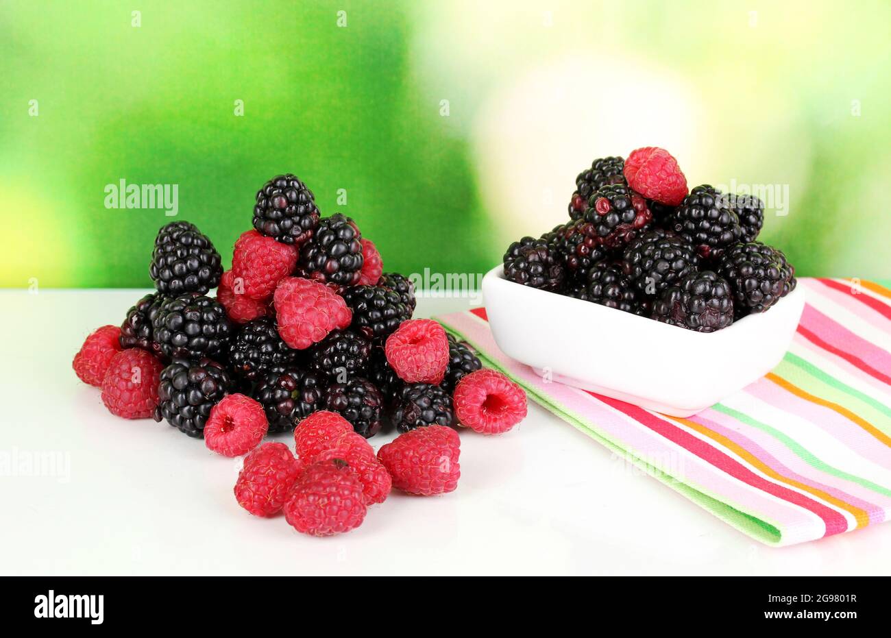 Hill raspberries and brambles on nature background Stock Photo - Alamy