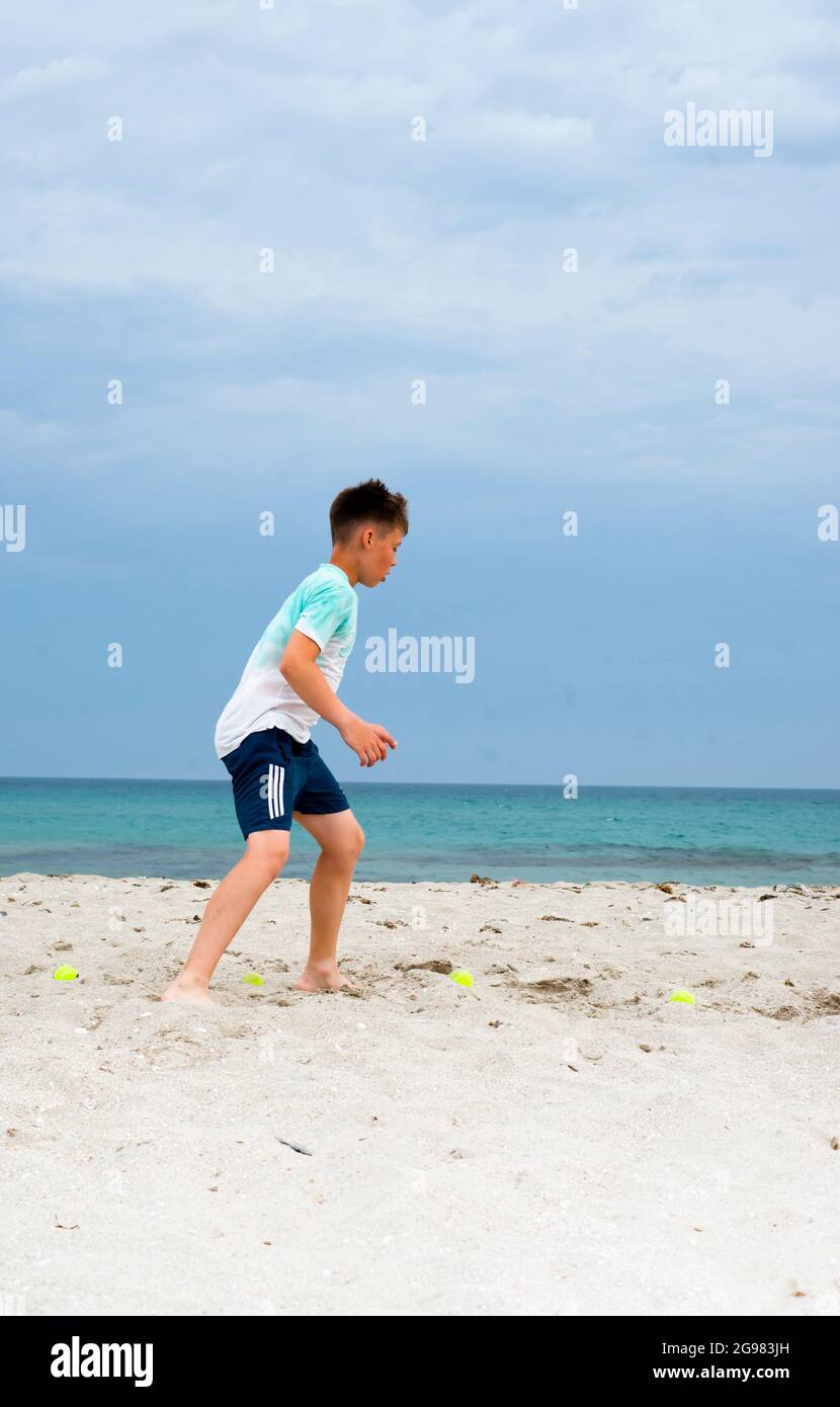 Trainings on the sandy beach. Physical training of athletes Stock Photo ...