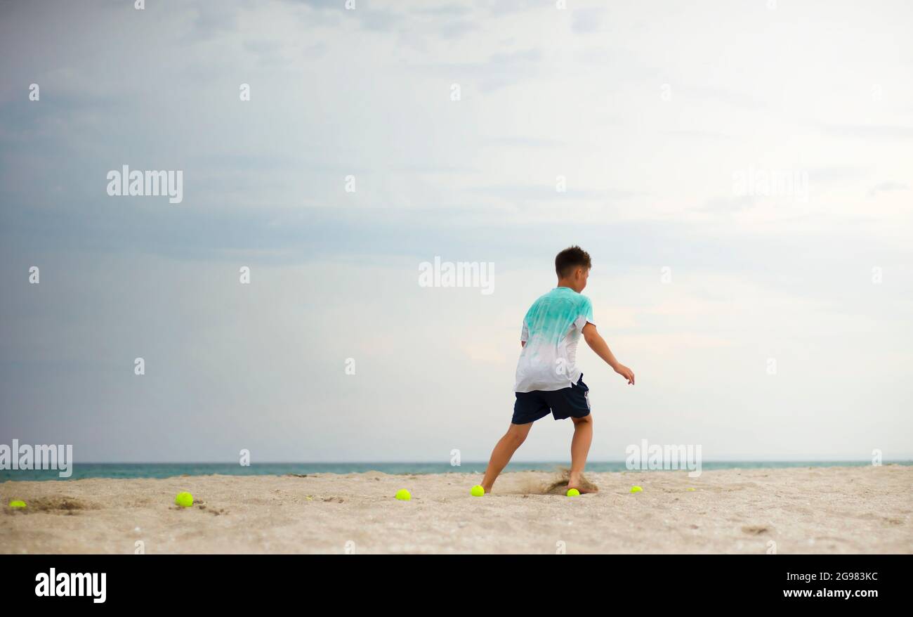 Trainings on the sandy beach. Physical training of athletes Stock Photo ...