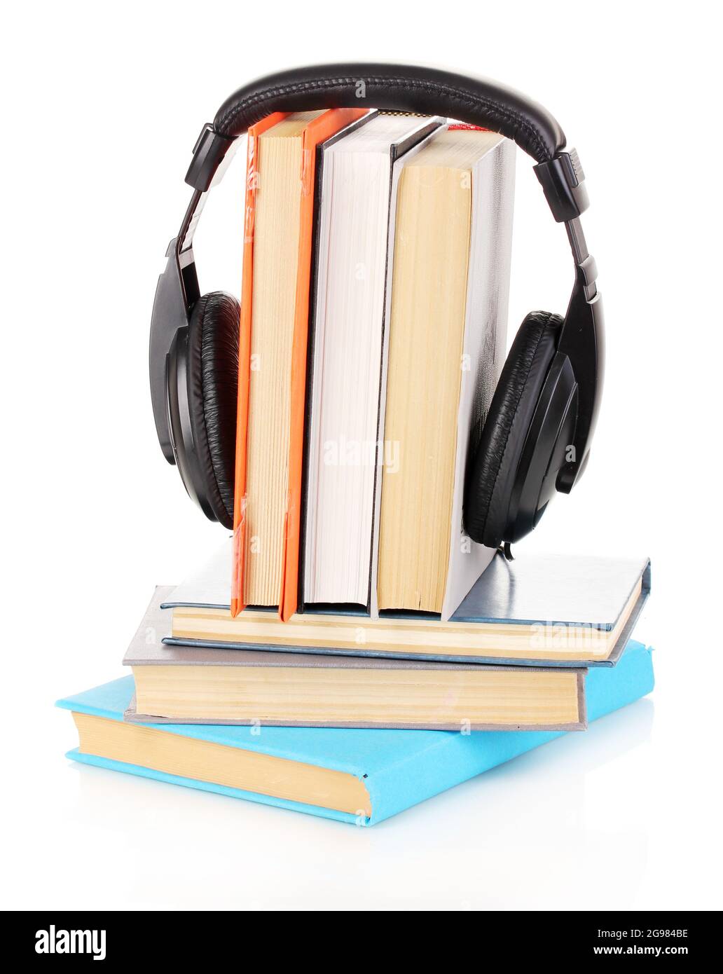 Headphones on books isolated on white Stock Photo - Alamy