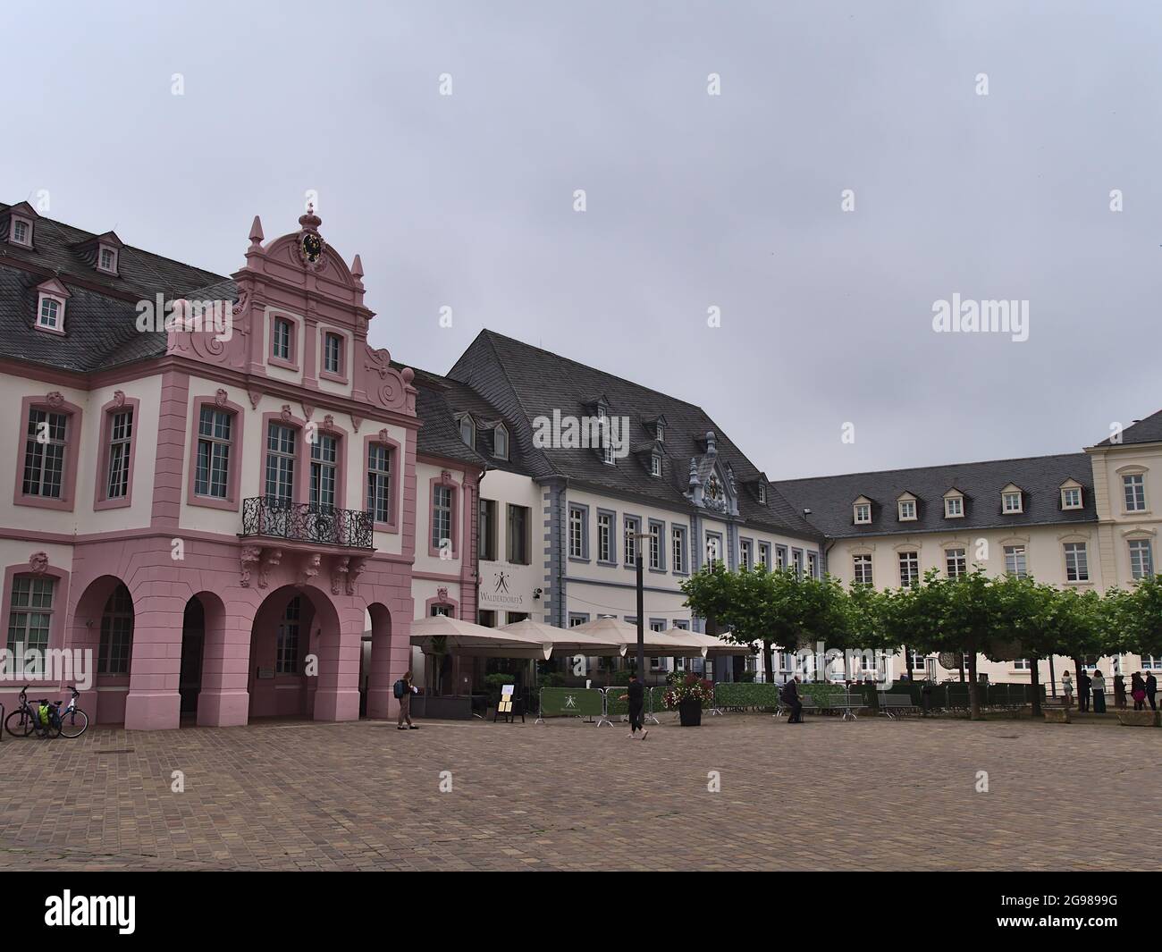 View of historic building with white and pink painted facade located on ...