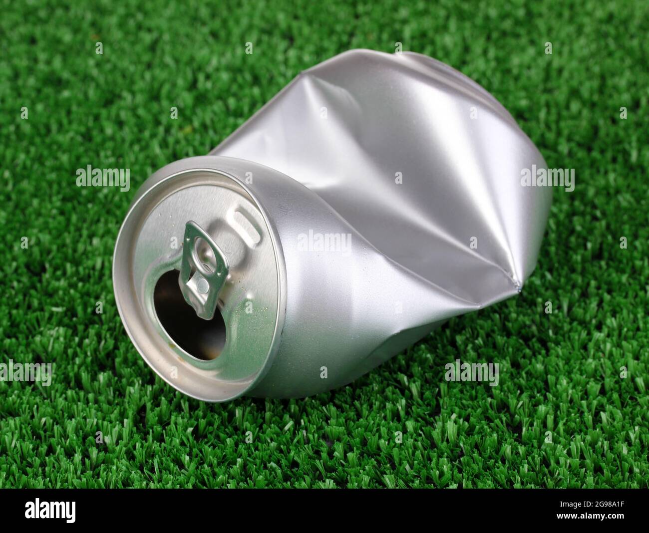 crumpled empty can on grass Stock Photo - Alamy