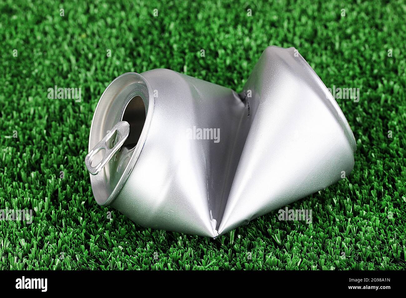crumpled empty can on grass Stock Photo - Alamy
