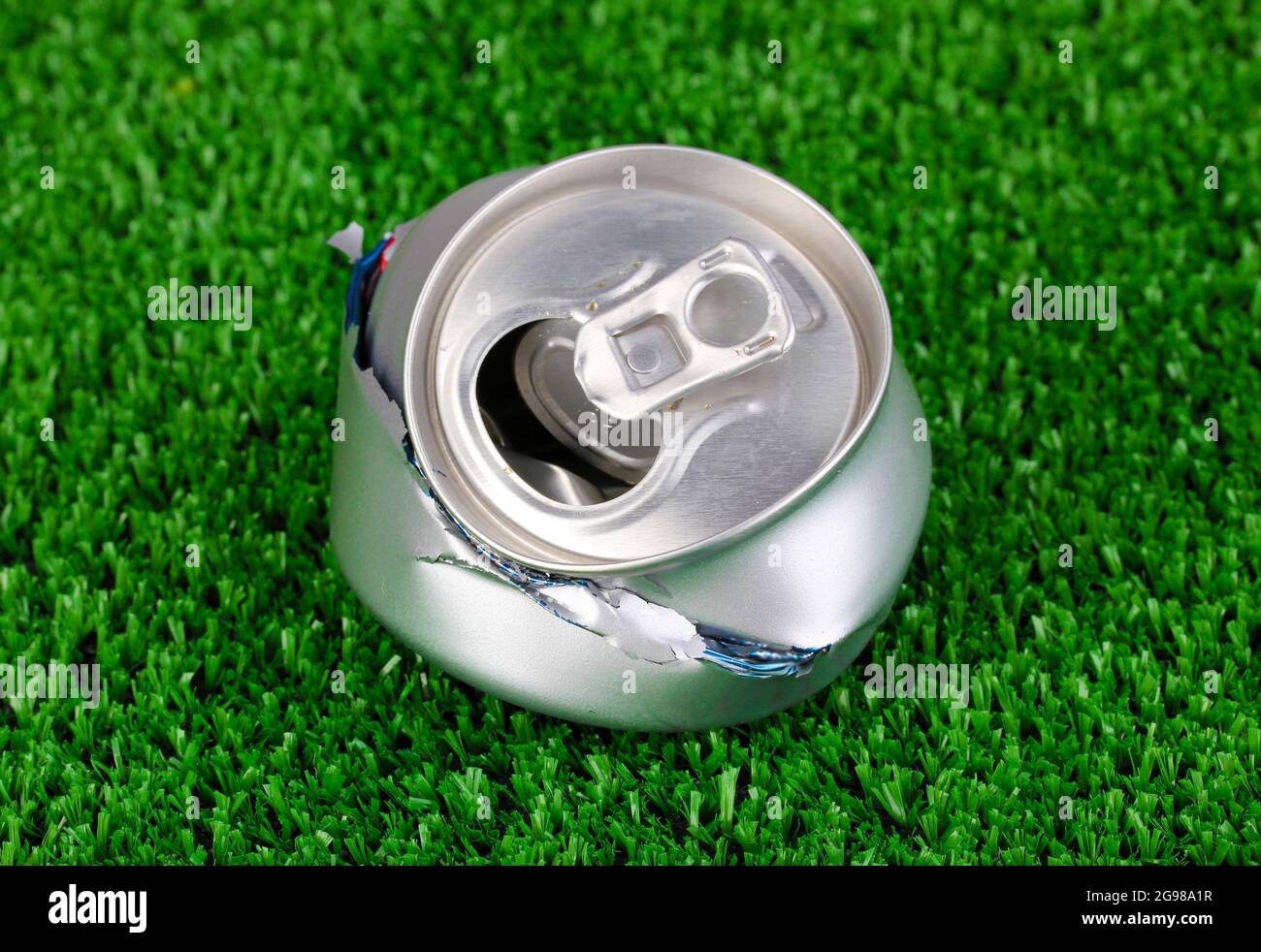 crumpled empty can on grass Stock Photo - Alamy