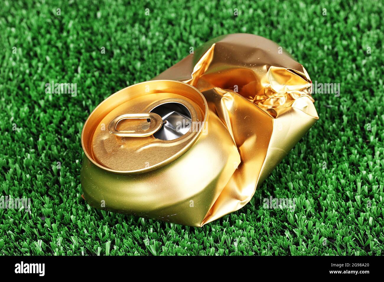 crumpled empty can on grass Stock Photo - Alamy