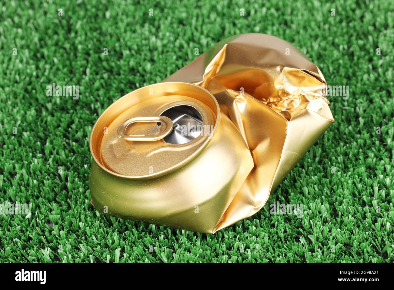 crumpled empty can on grass Stock Photo - Alamy