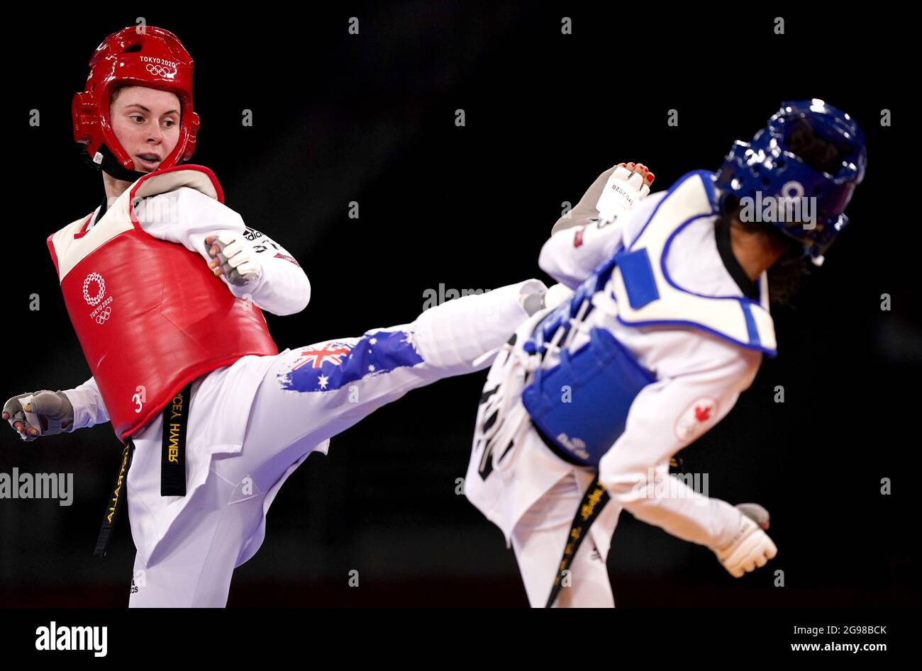 Australia's Stacey Hymer (left) competes against Canada's Skylar Park ...