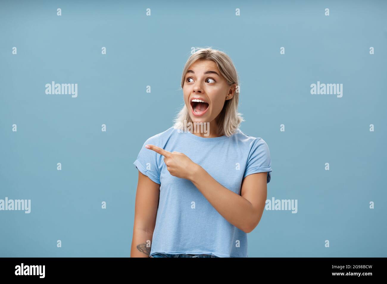 Girl being charmed and excited visiting awesome event pointing and ...