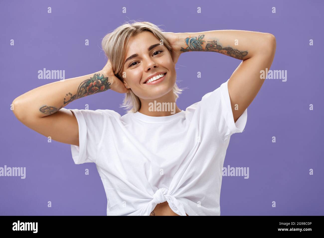 Close-up shot of good-looking stylish and relaxed blond woman with ...