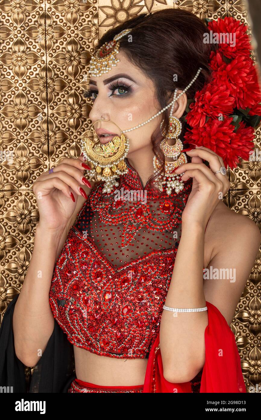 Beautiful Asian bride in red dress in the saloon Stock Photo - Alamy