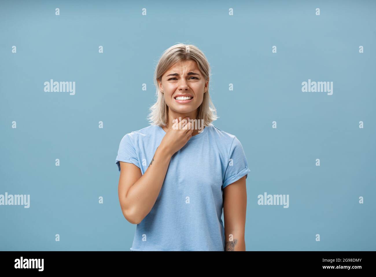 Girl feeling discomfort in throat catching cold or having seasonal ...