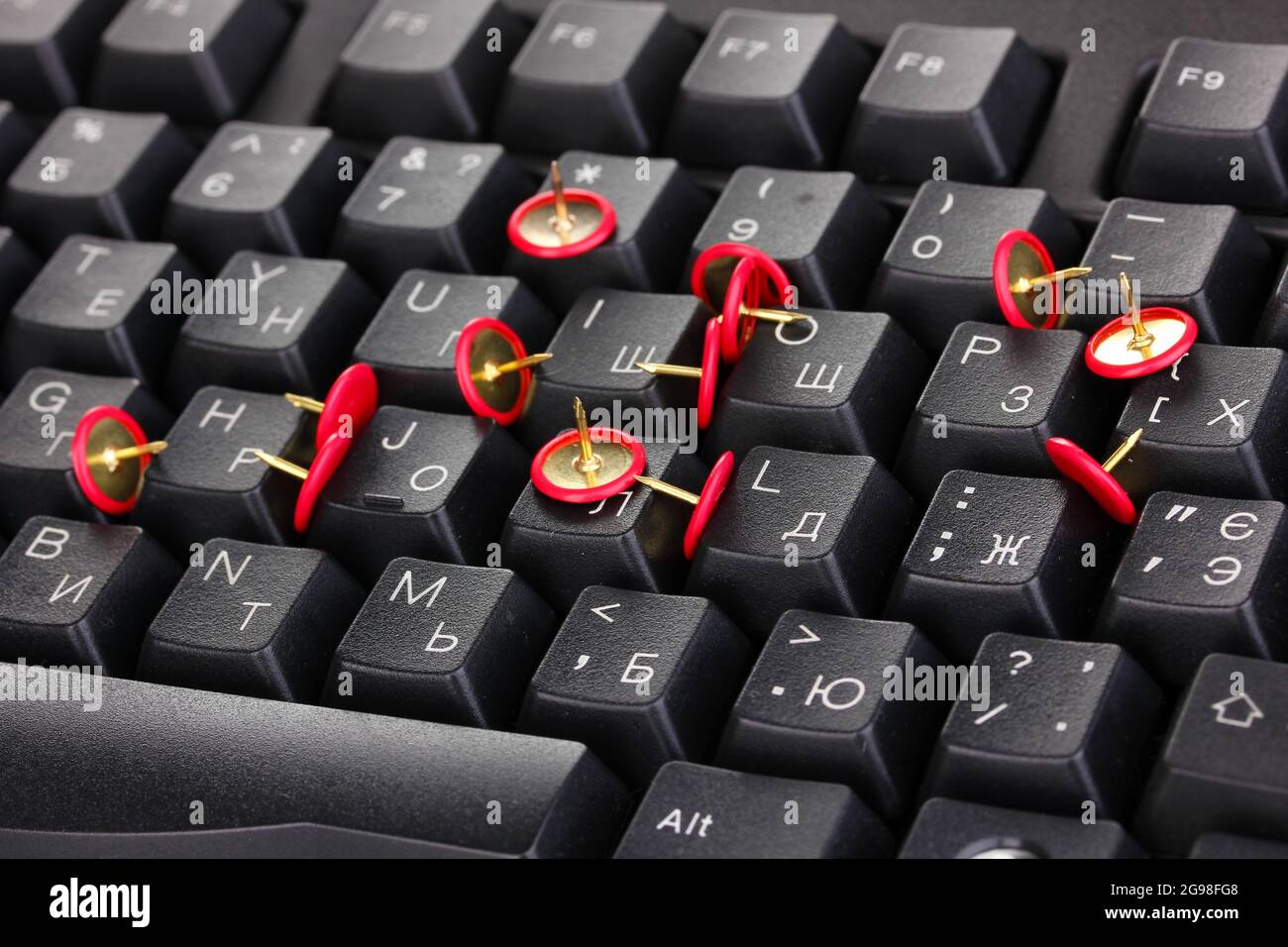 Painful typing, pins on keyboard close-up Stock Photo - Alamy