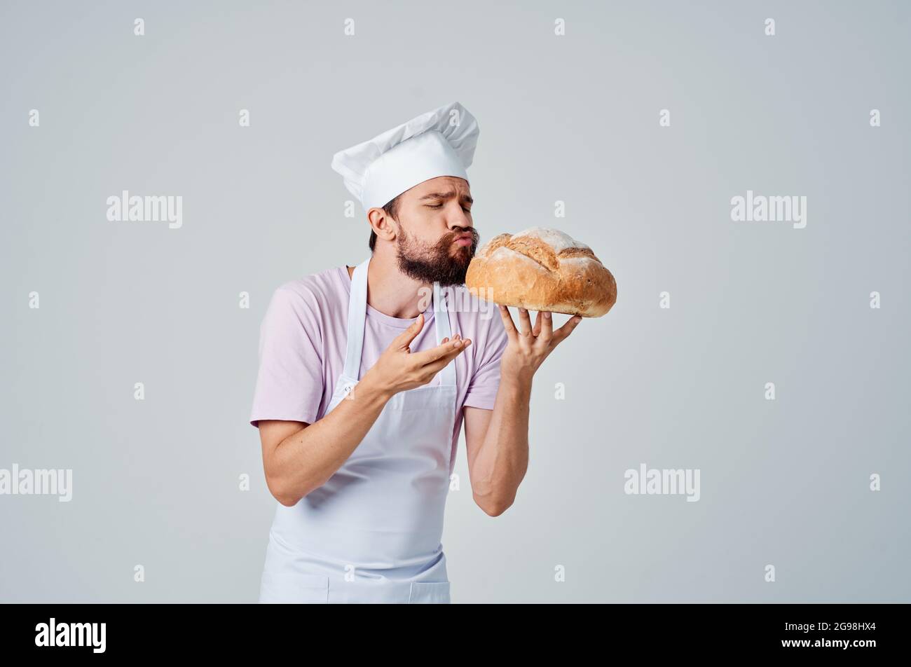 emotional chef with bread in his hands baking cooking Stock Photo - Alamy