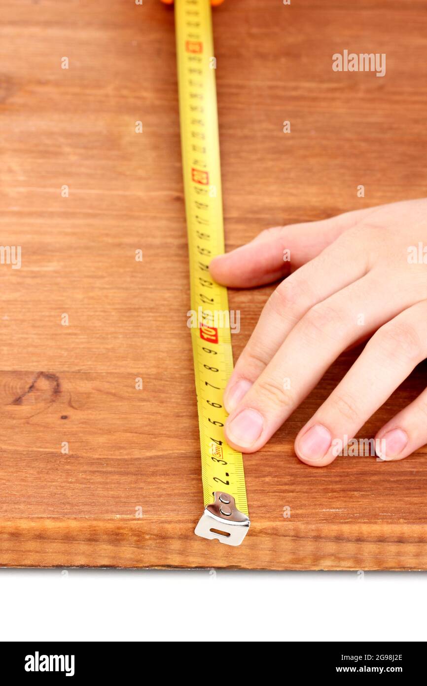 measuring wooden board close-up Stock Photo - Alamy