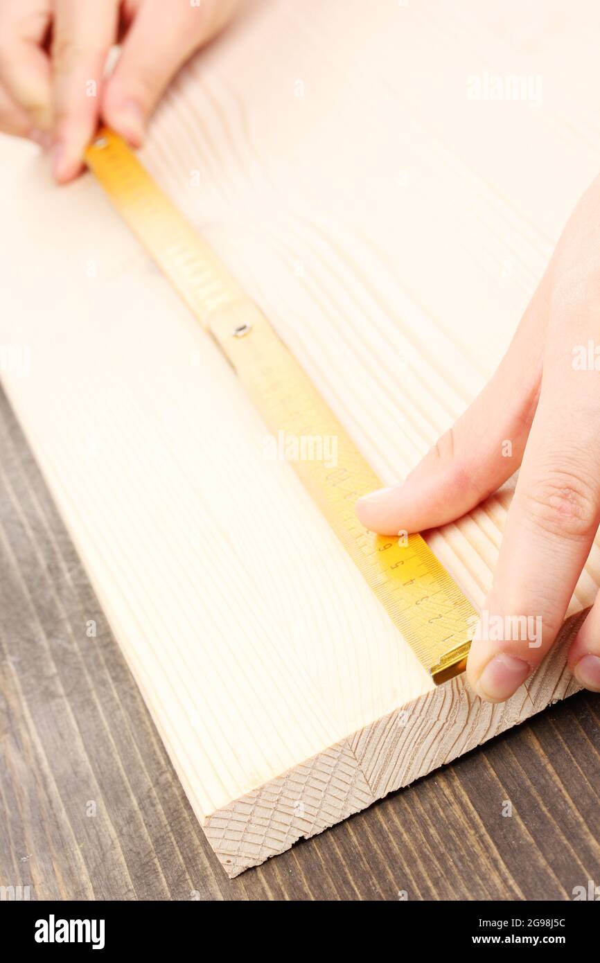 measuring wooden board close-up Stock Photo - Alamy