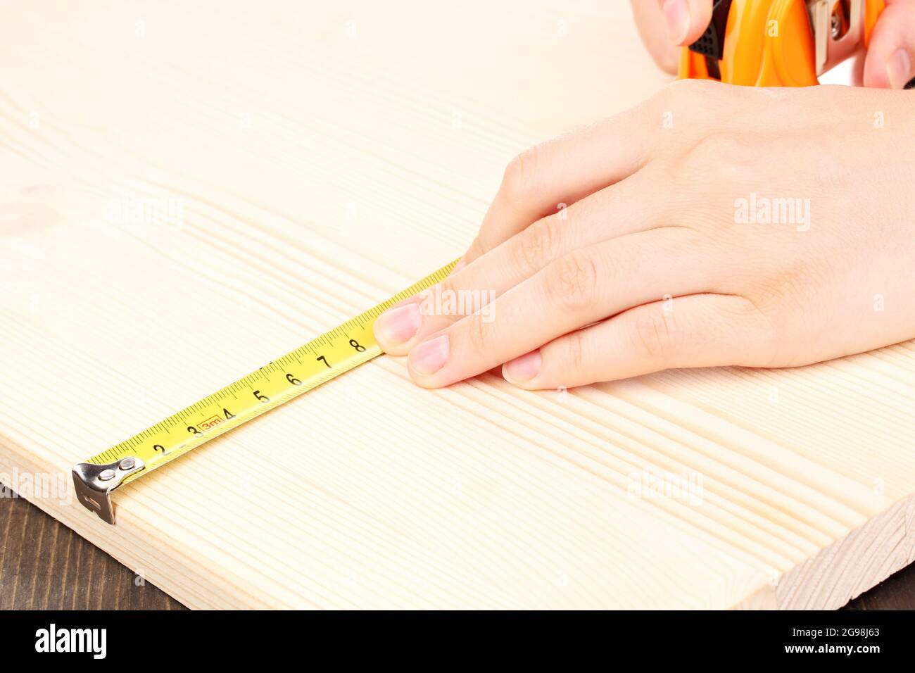 measuring wooden board close-up Stock Photo - Alamy
