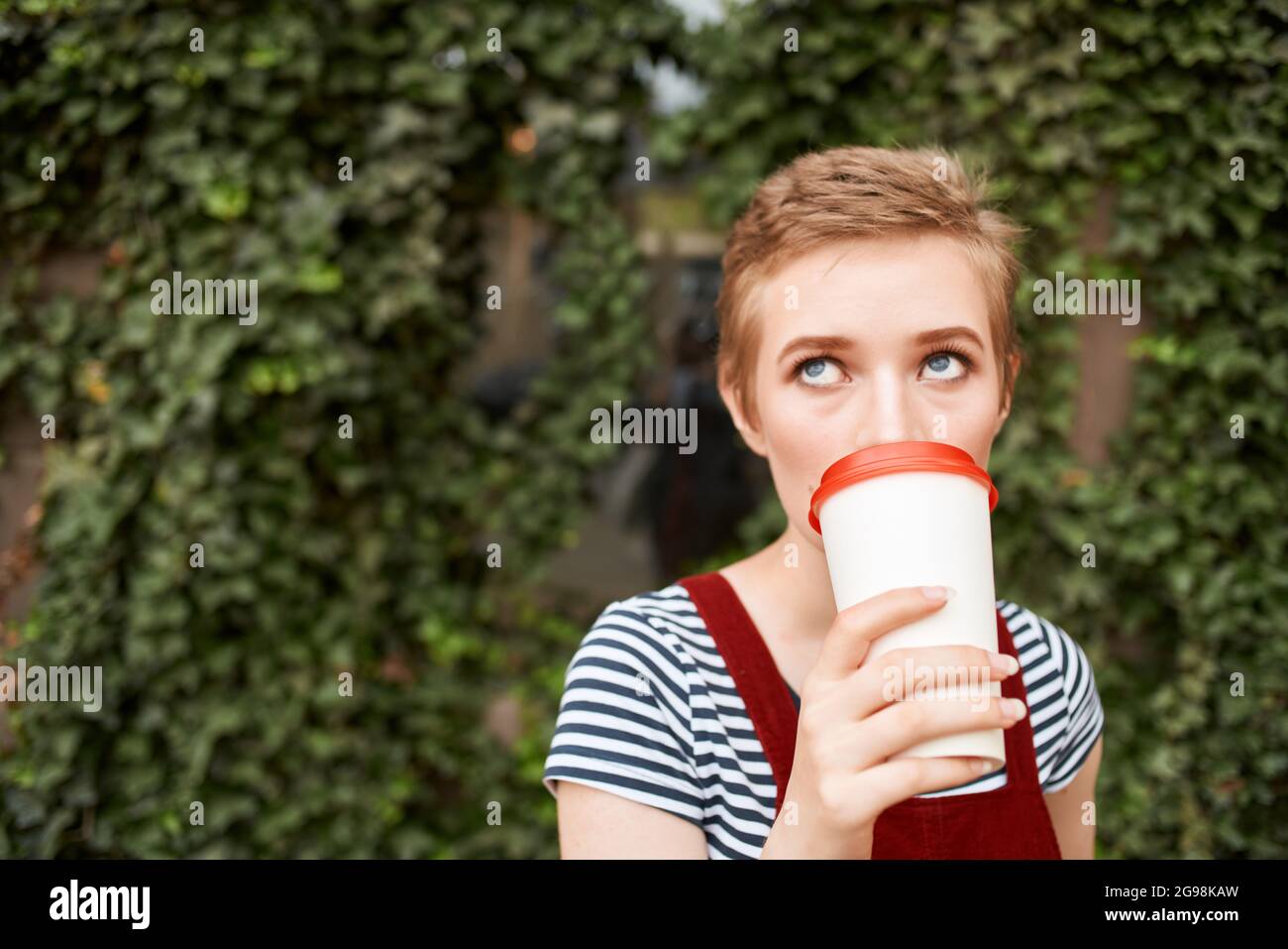 cute short haired woman cup of coffee outdoors fun Stock Photo - Alamy