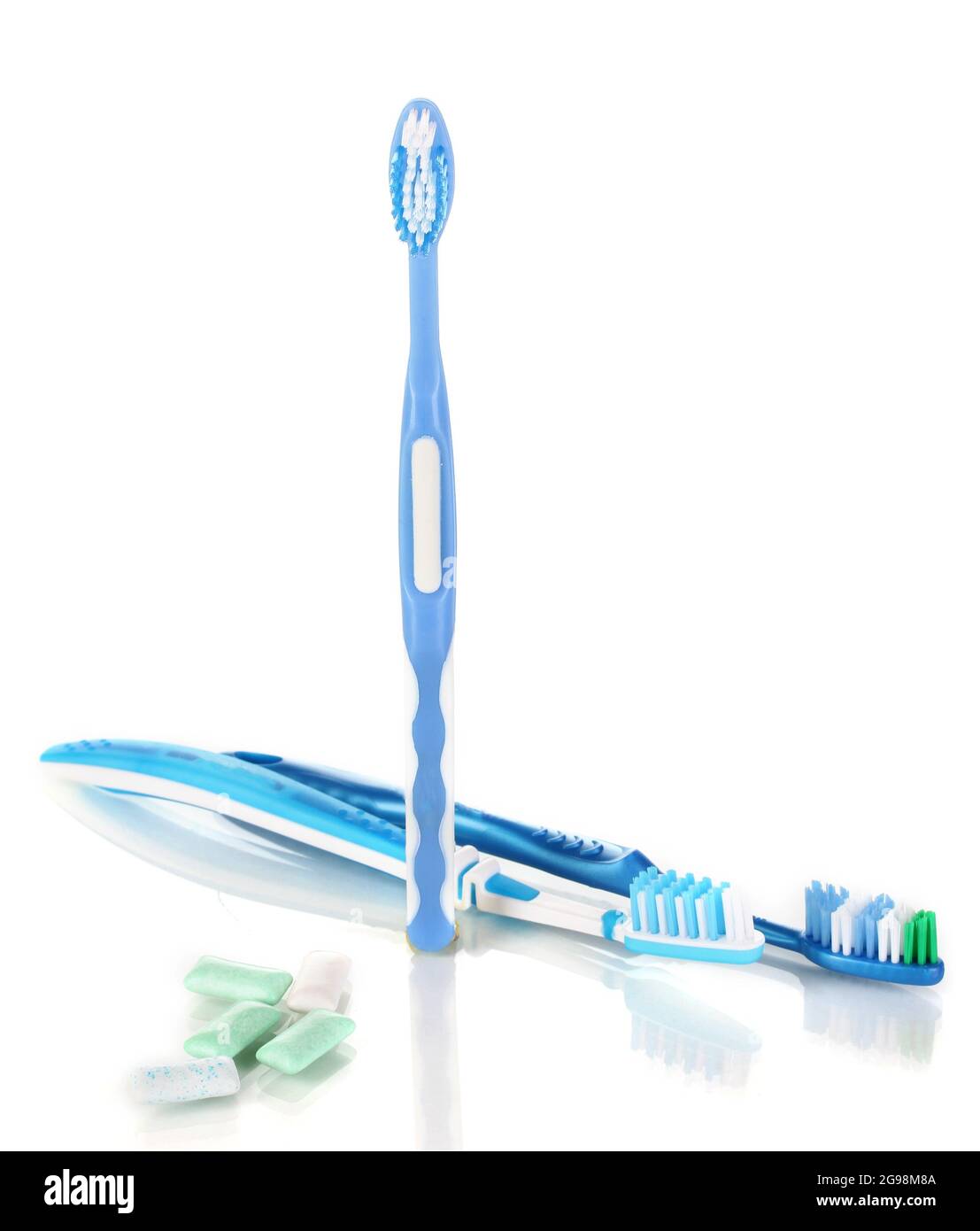 Toothbrushes and chewing gum isolated on white Stock Photo - Alamy