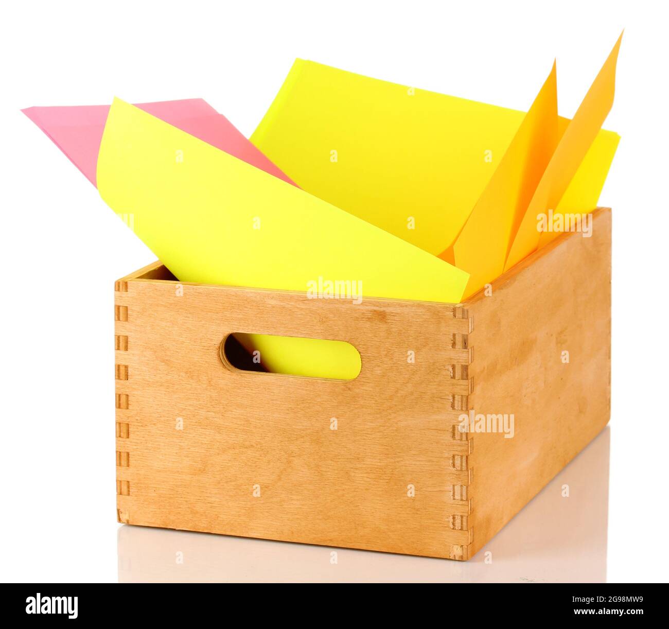 Wooden crate with colorful papers isolated on white Stock Photo - Alamy