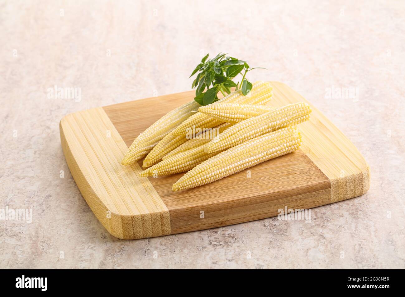 Vegan food - raw baby corn for cooking Stock Photo - Alamy