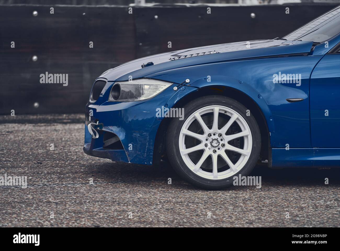 Front side view of black car driving fast Stock Photo - Alamy