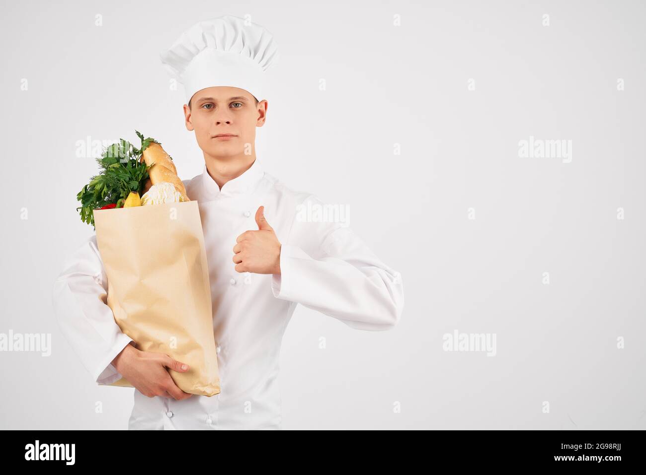 man in chef uniform food delivery supermarket service Stock Photo - Alamy