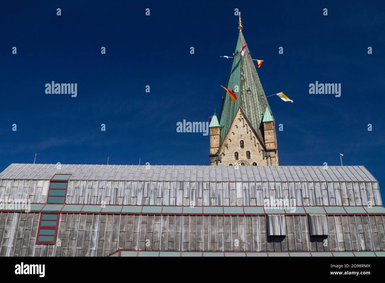Paderborn Cathedral bell tower behind another building roof, Paderborn ...