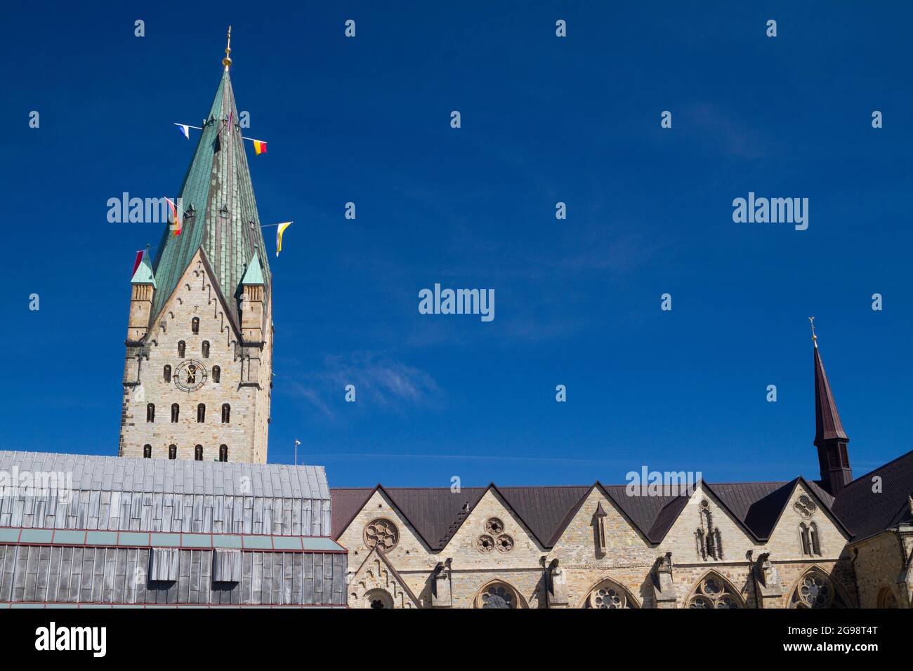 Paderborn Cathedral bell tower behind another building roof, Paderborn ...